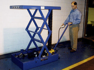 Scissor lift table / electric / stationary / push-pull chain - Serapid ...