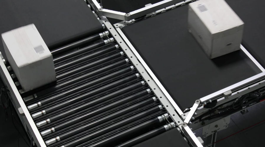 Cardboard box sorter - DEMATIC - bag / belt