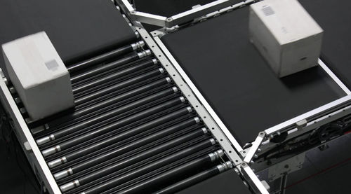 Cardboard box sorter - DEMATIC - bag / belt